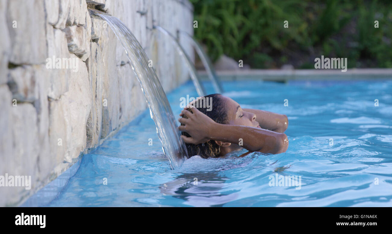 Relaxing swimming pool waterfall hi-res stock photography and images ...