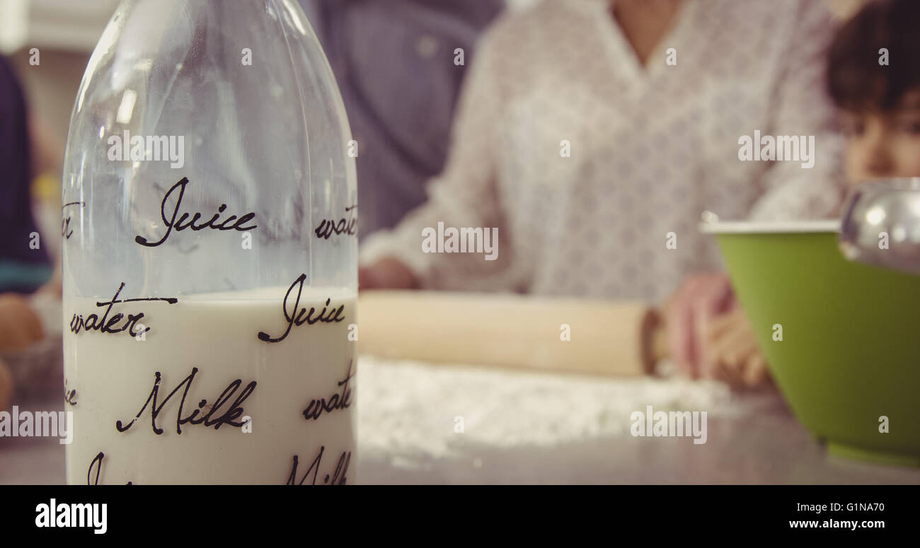 Happy family baking in the kitchen Stock Photo - Alamy