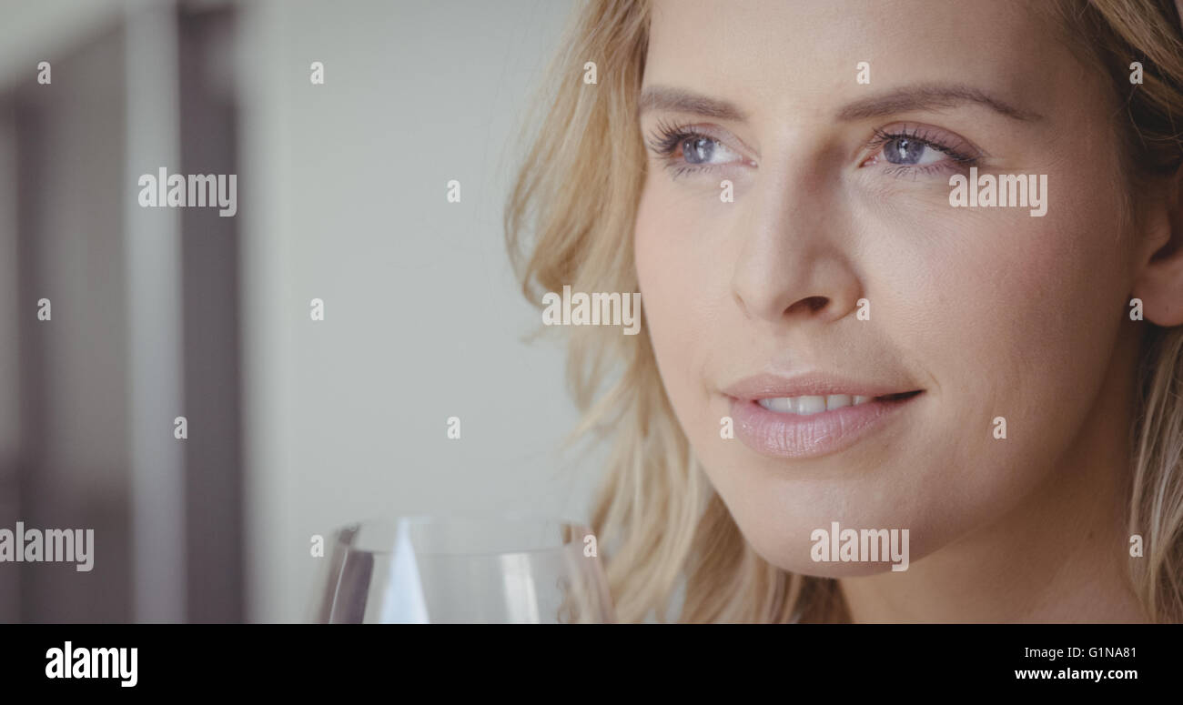 Woman looking outside Stock Photo - Alamy