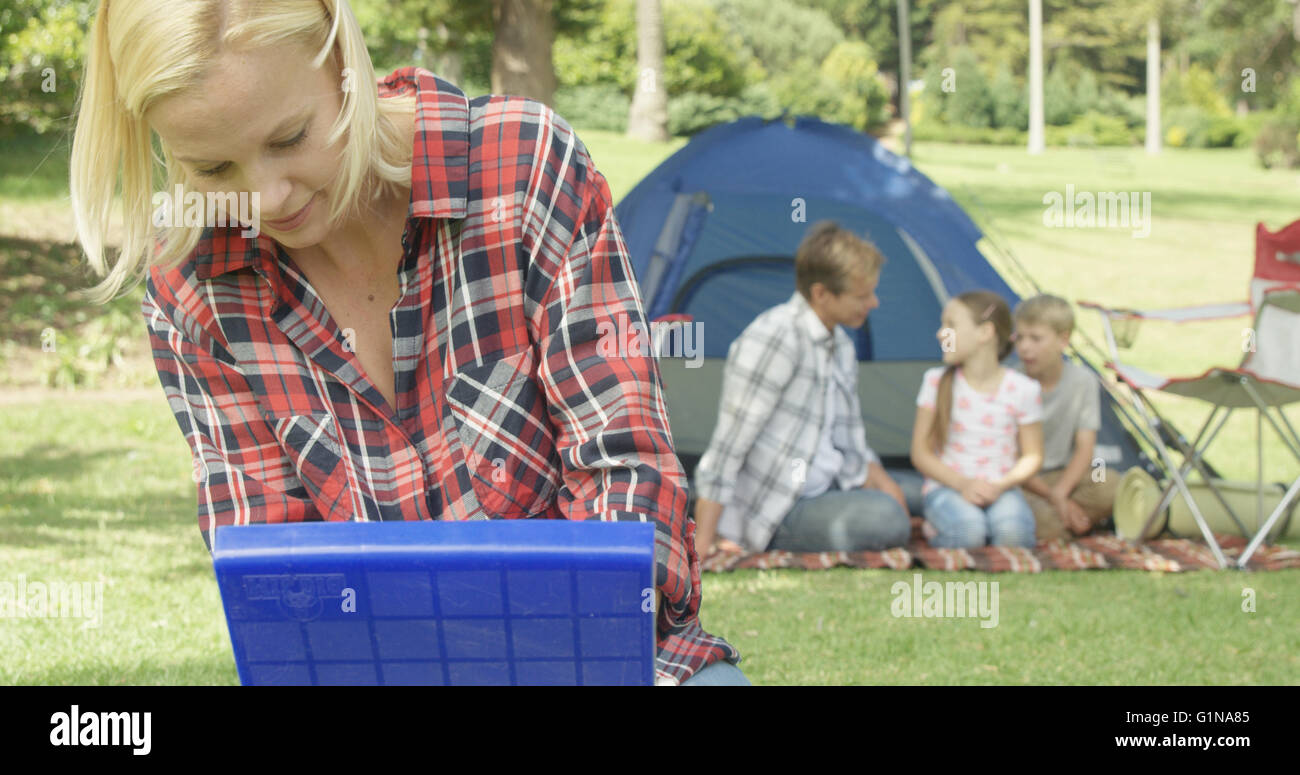 Happy family on a camping trip Stock Photo - Alamy
