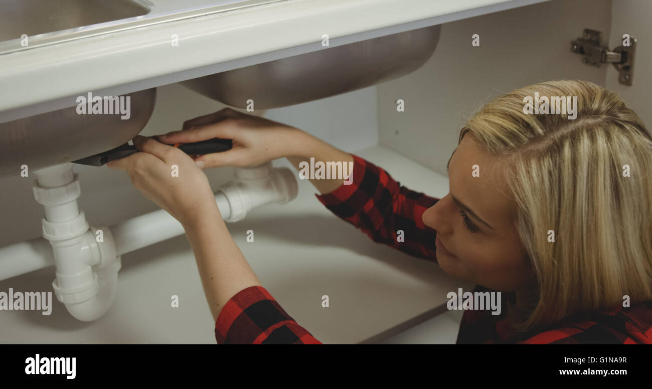 Woman tap hi-res stock photography and images - Alamy