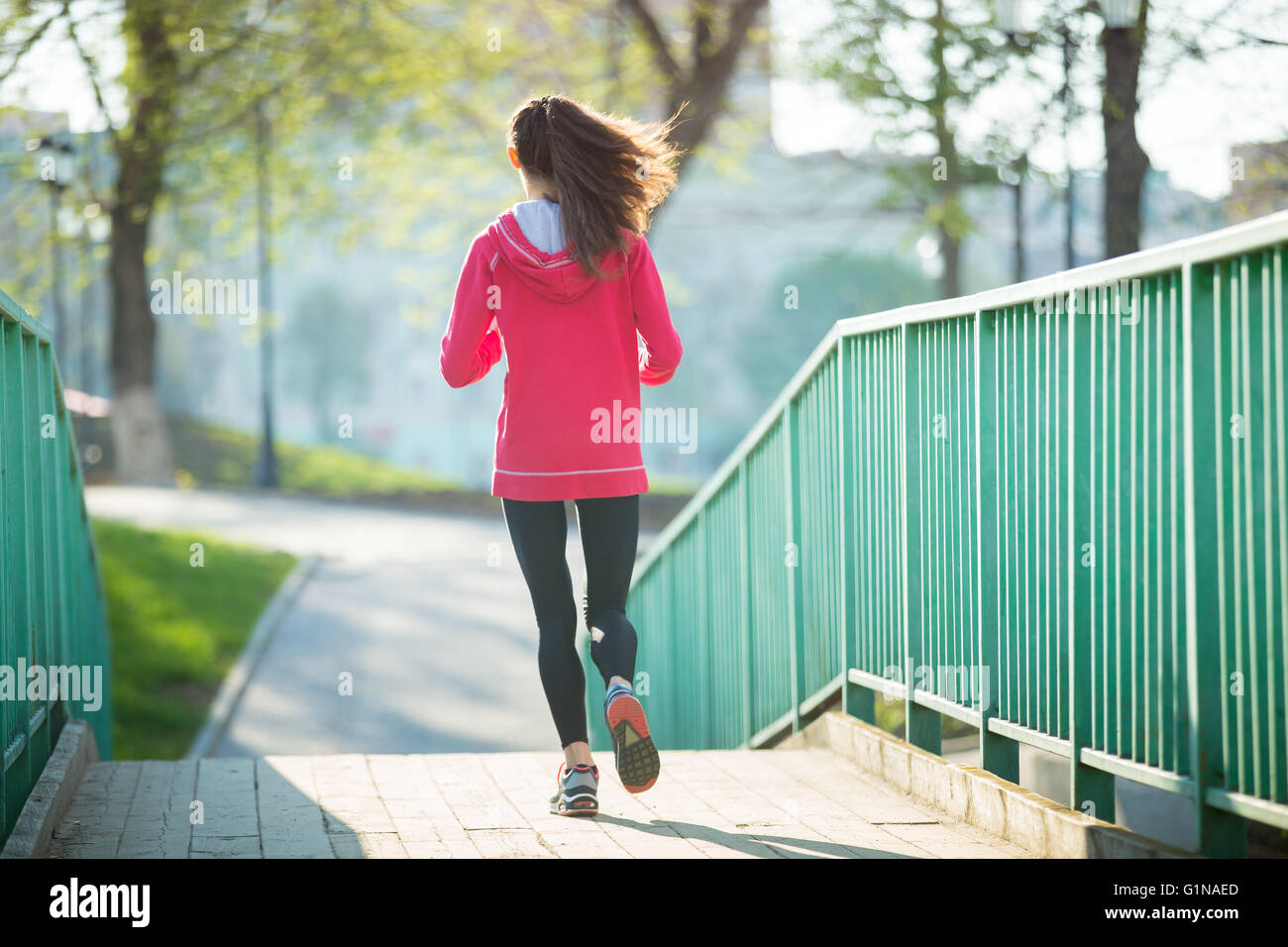 Female running back view full length hi-res stock photography and ...