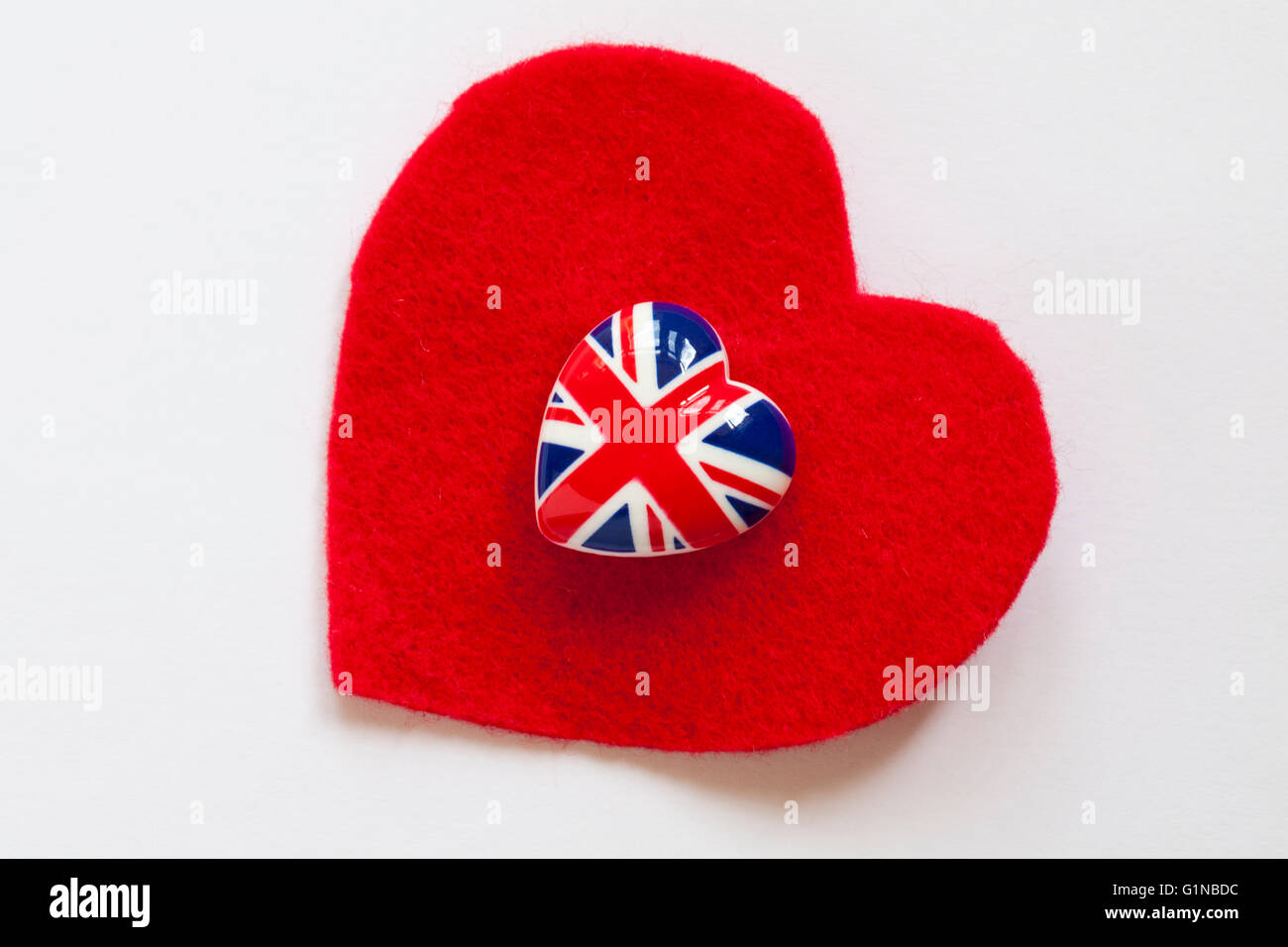 Handmade badge with Union Jack heart badge on red felt heart isolated ...