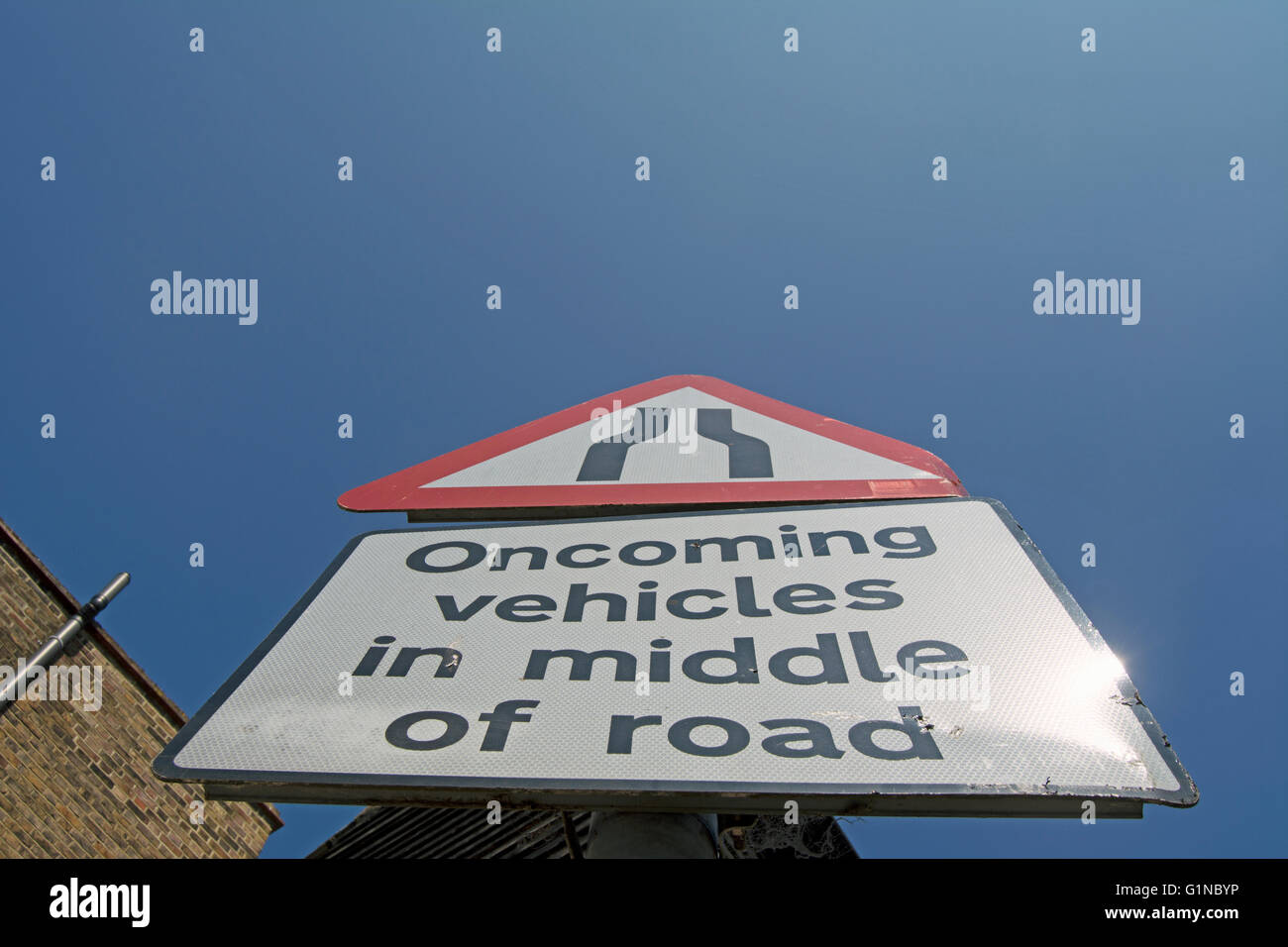 Oncoming vehicles in middle of road sign hi-res stock photography and ...