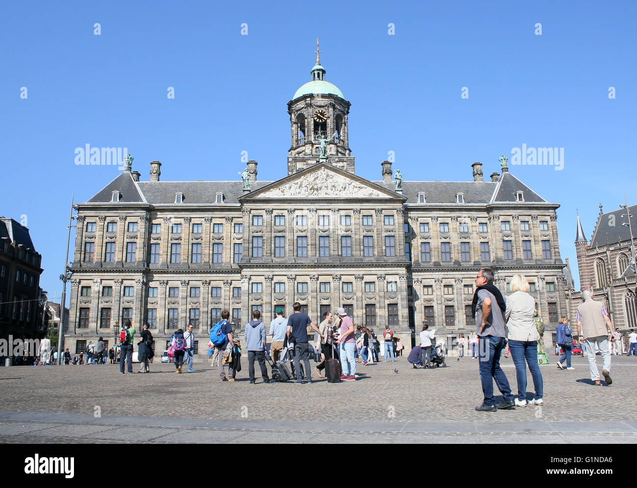 Tourists in front of the 17th century Paleis op de Dam - Royal Palace ...