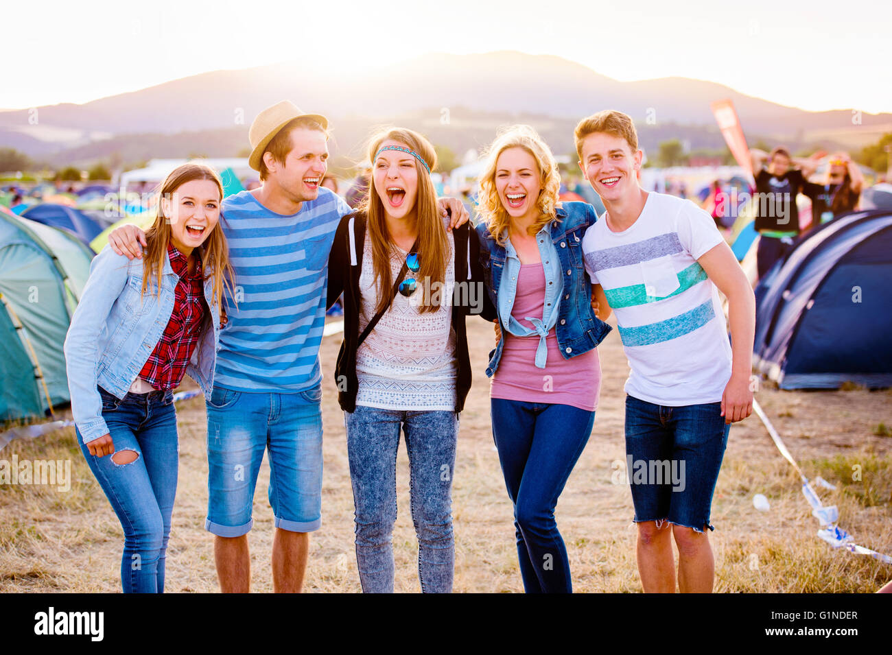 Group of teenagers at summer music festival, sunny day Stock Photo - Alamy