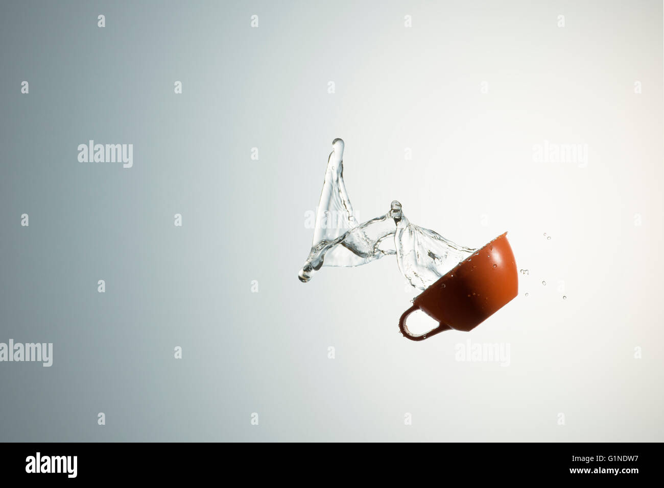 A goblet spilling out water Stock Photo - Alamy