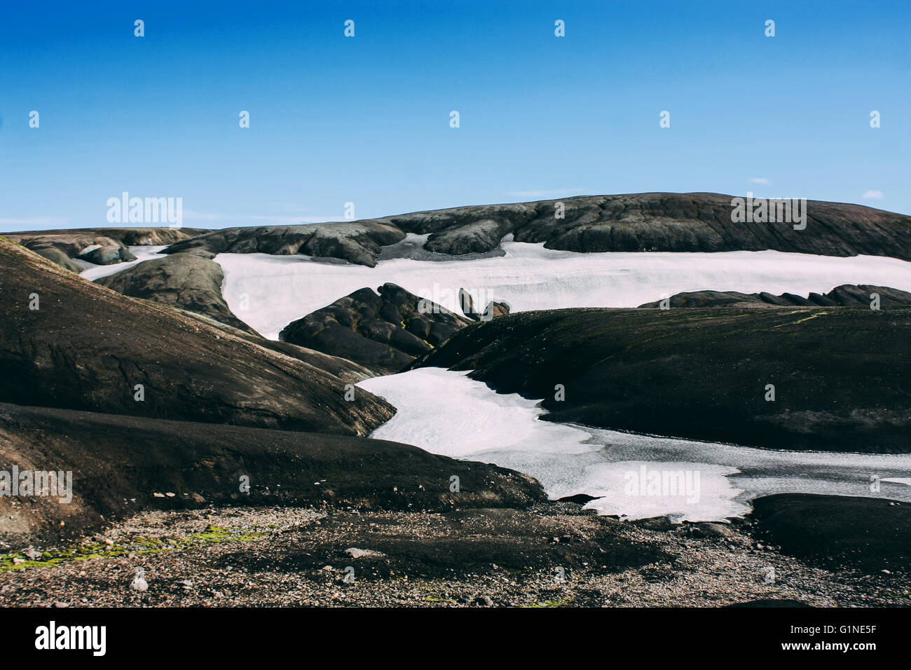 Landscape with moss and snow in Iceland. Mountain tourism Stock Photo ...