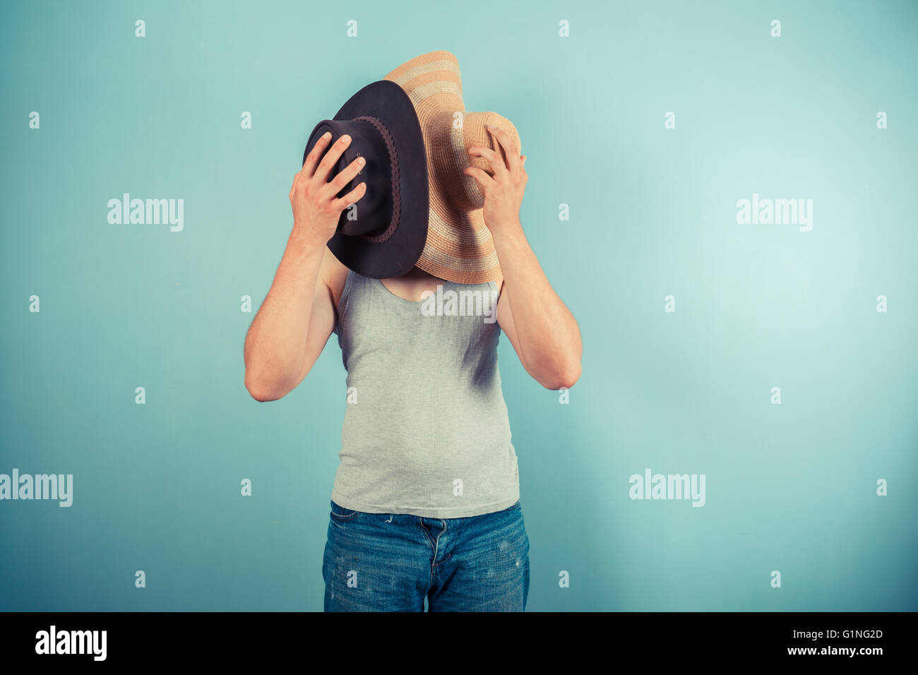 Man with two hats hi-res stock photography and images - Alamy