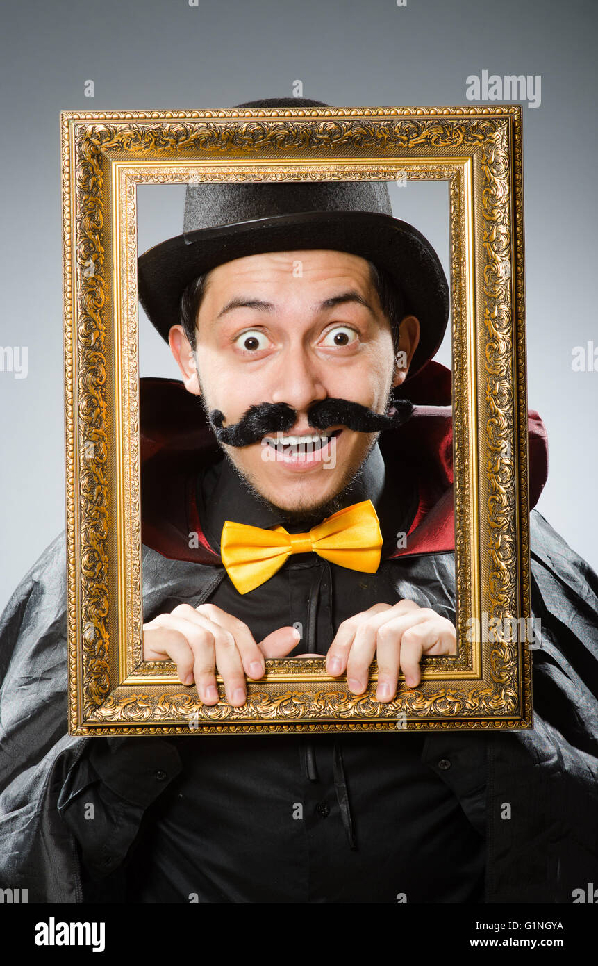 Funny man with picture frame Stock Photo - Alamy