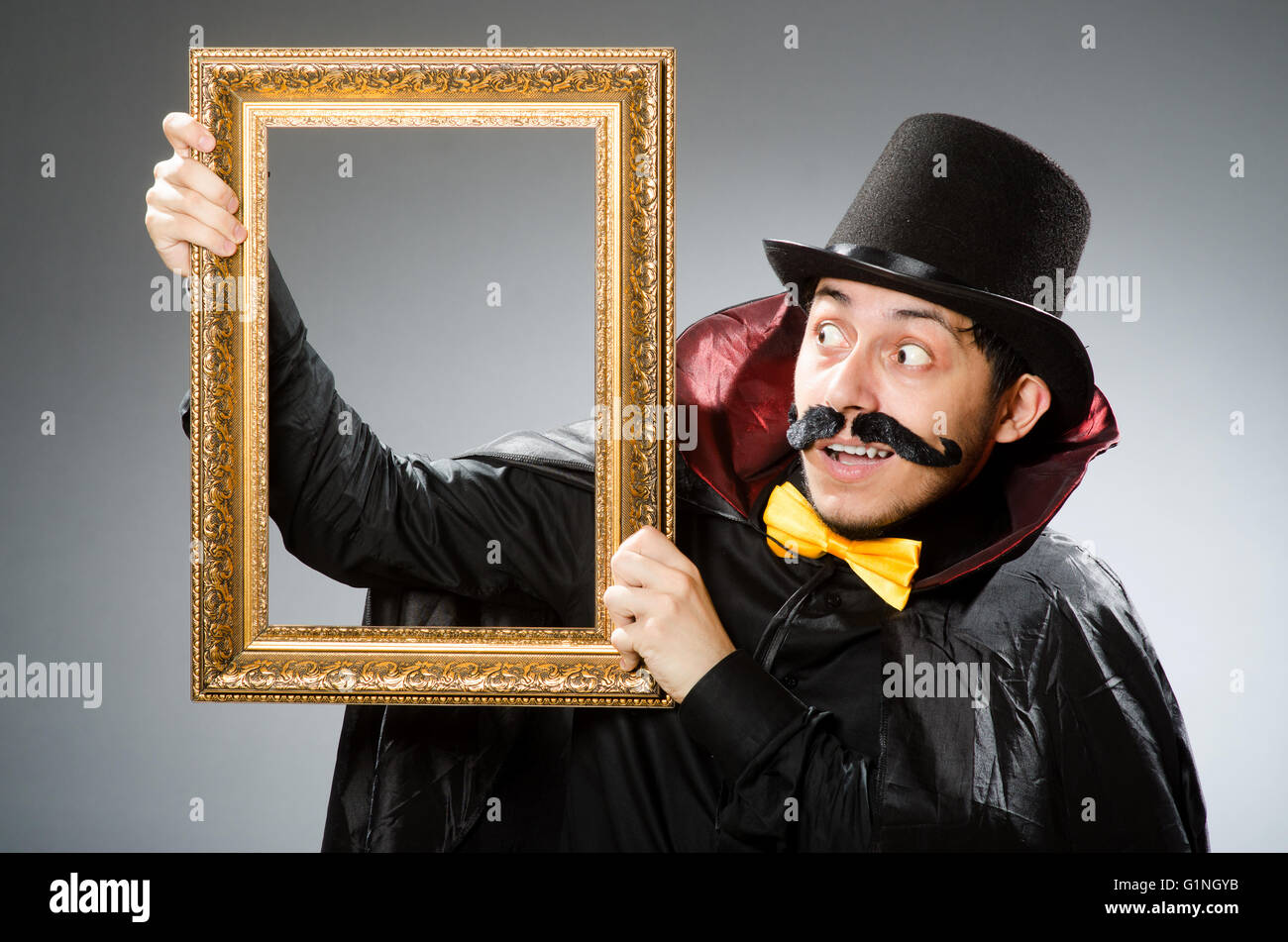 Funny man with picture frame Stock Photo - Alamy