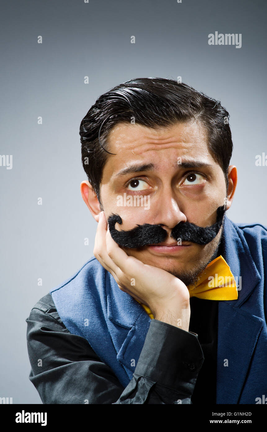 Funny man against dark background Stock Photo - Alamy