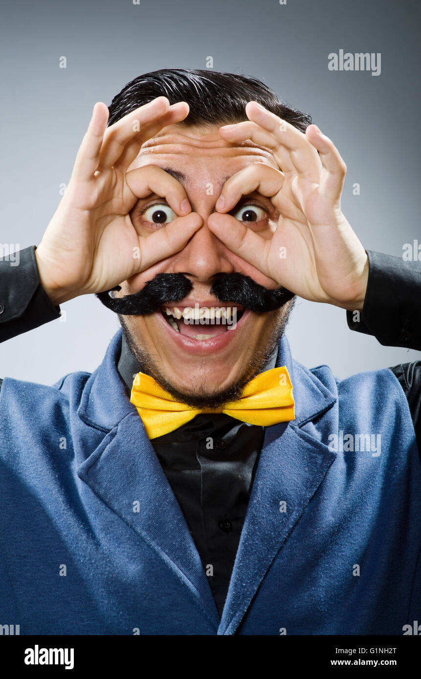 Funny man against dark background Stock Photo - Alamy