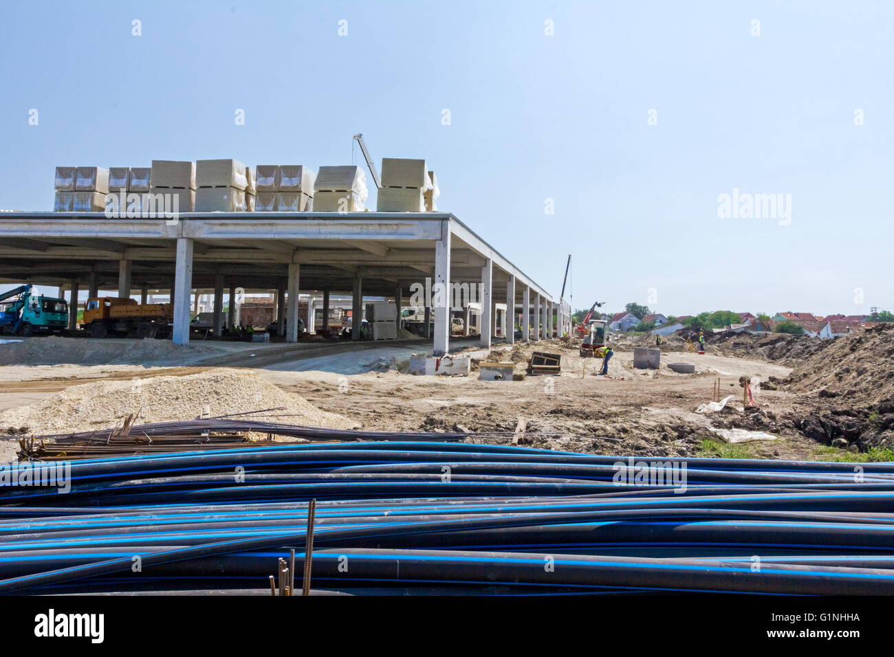 View on construction site with machinery, people at work. Landscape ...