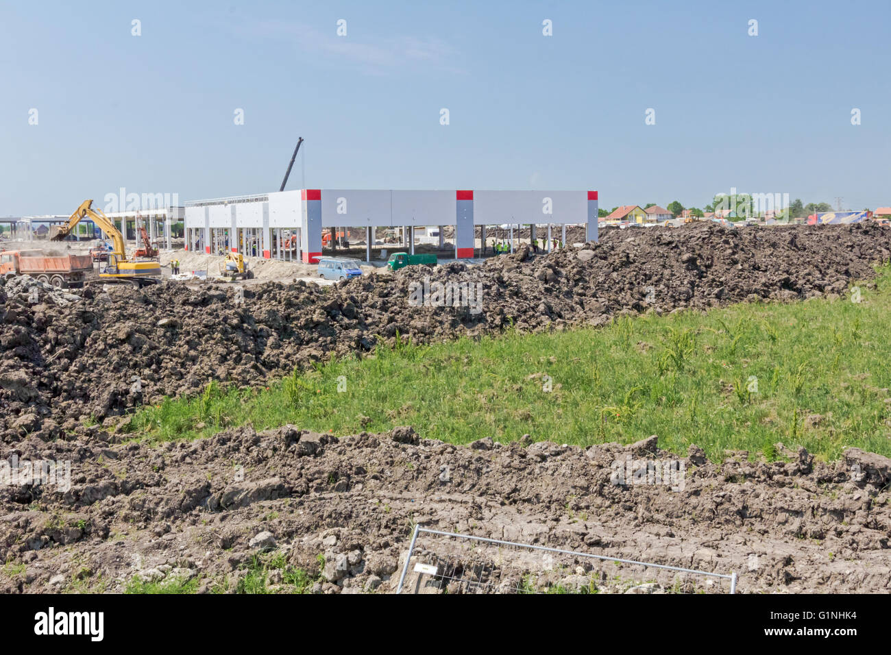 Landscape transform into urban area with machinery, people are working ...