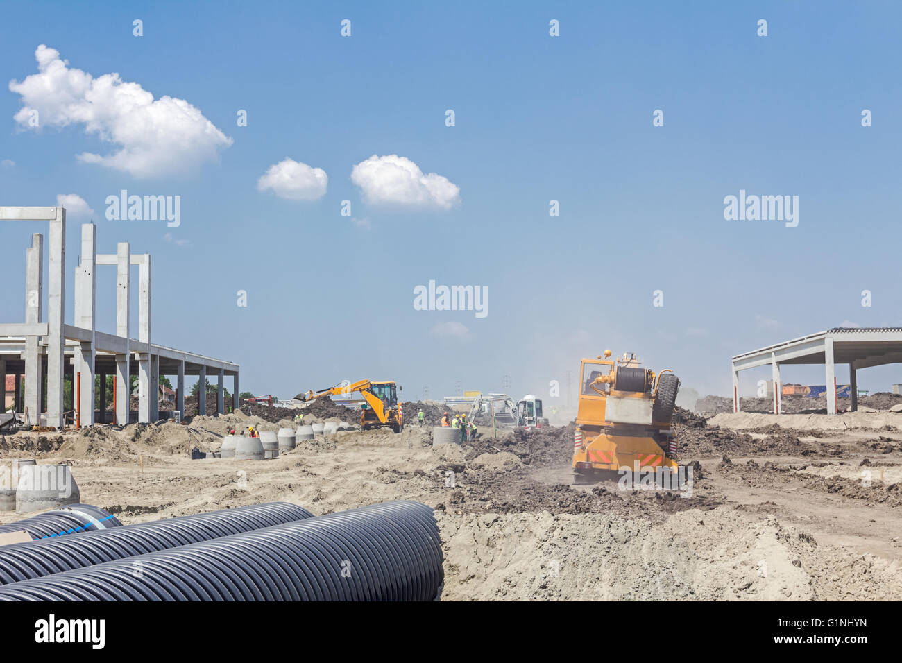 View on construction site with machinery, people at work Stock Photo ...