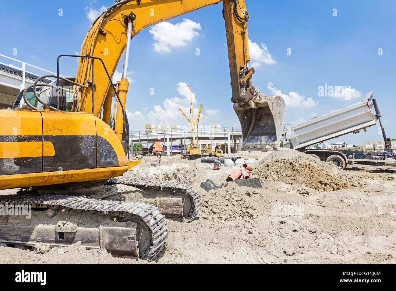 Landscape transform into urban area with machinery, people are working ...