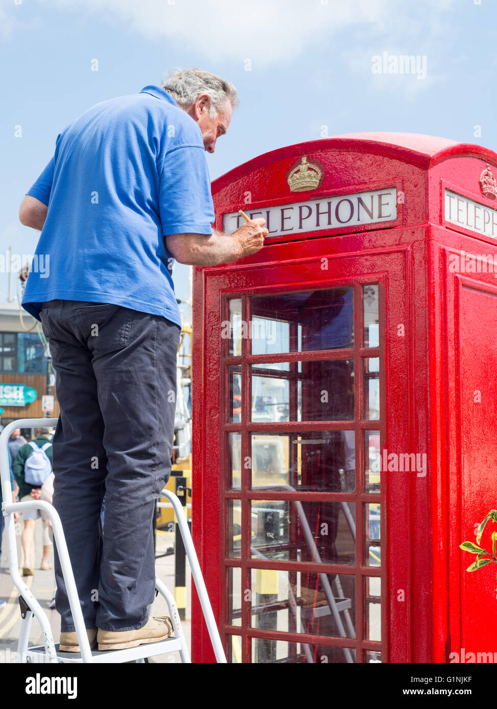 Red telephone box maintenance, Devon, UK Stock Photo - Alamy