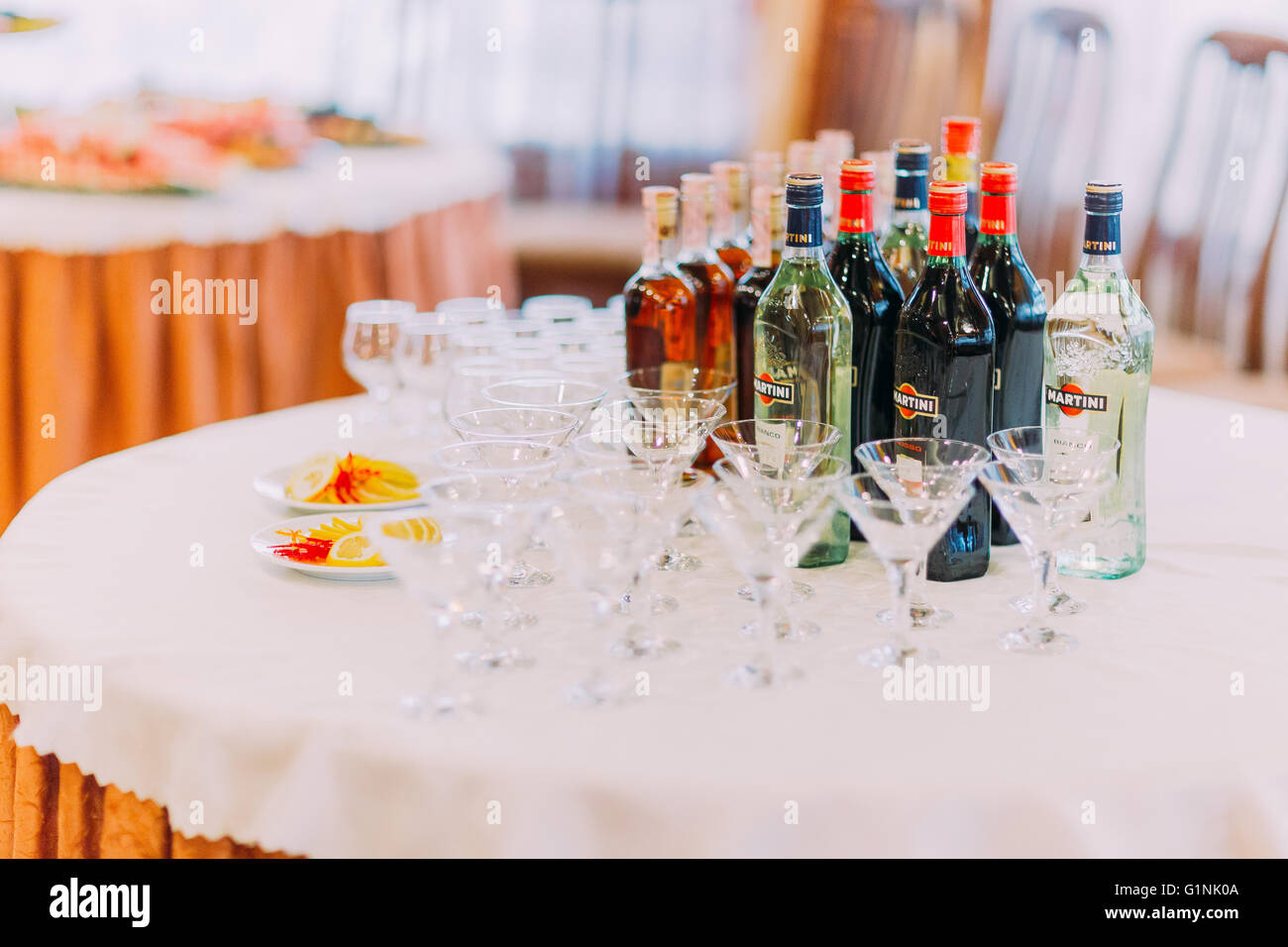 Close-up view of restaurant table setting with cocktail glasses and ...