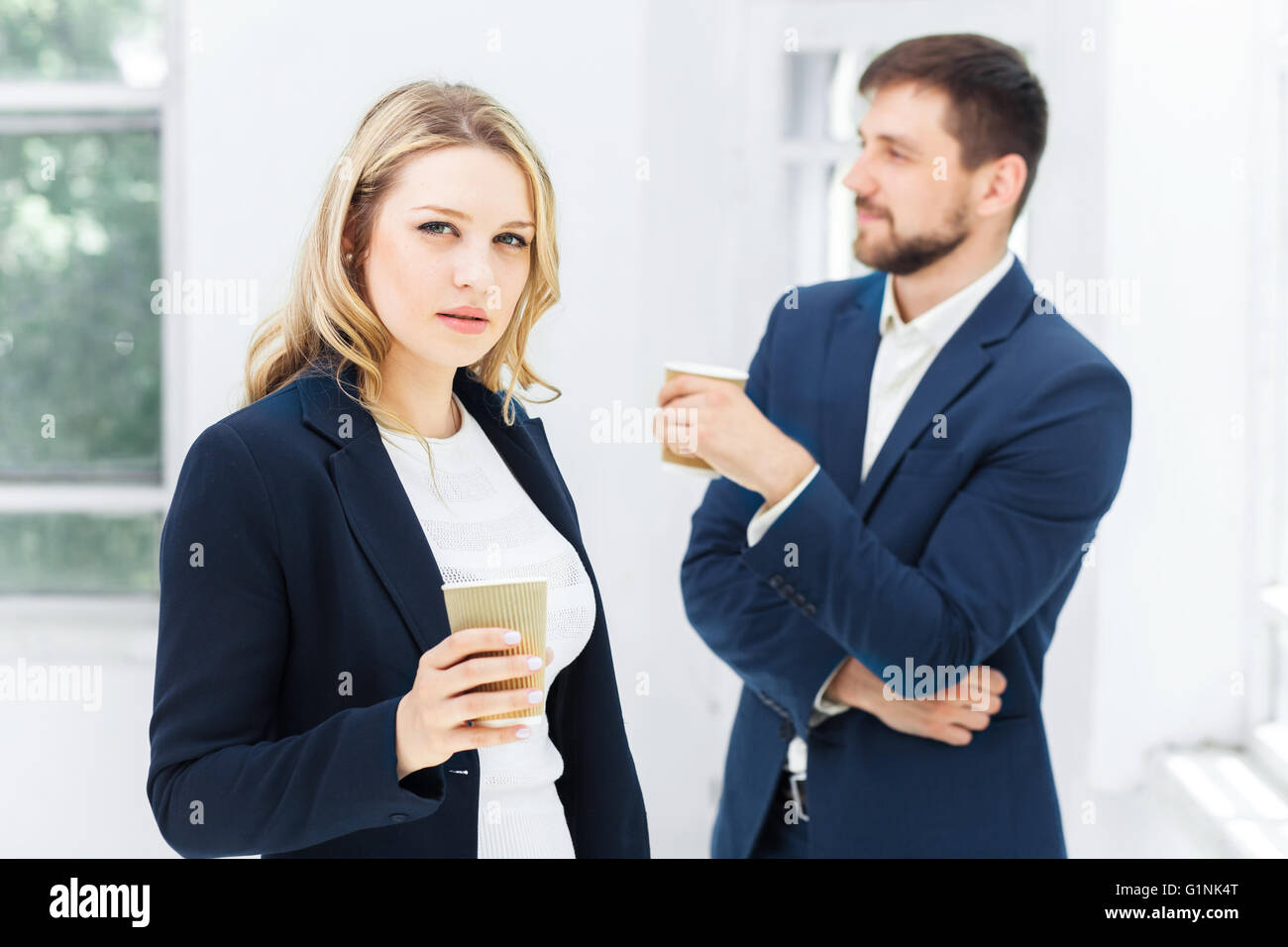 Young colleagues having coffee break in office Stock Photo - Alamy