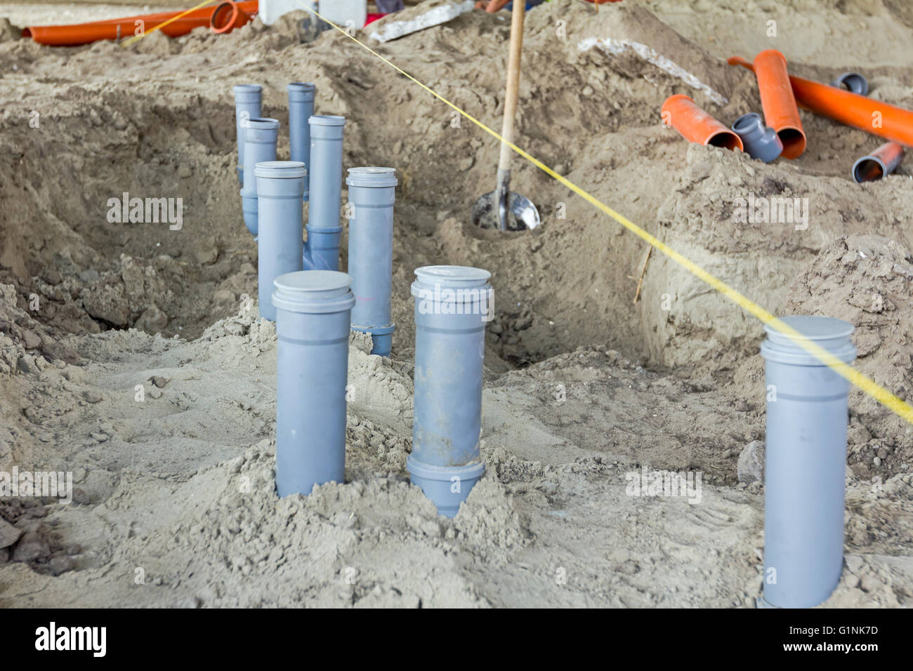 Set of waste pipes are assembled and lined up on building site Stock ...