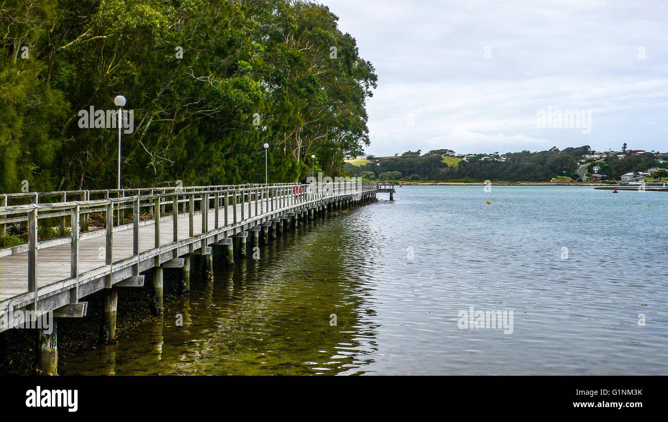 Narooma boardwalk surrounded by blue inlet and forest Stock Photo - Alamy