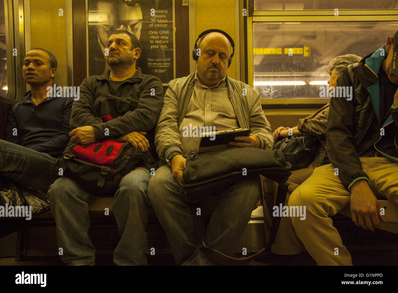 People riding home after work on a New York City subway train Stock ...