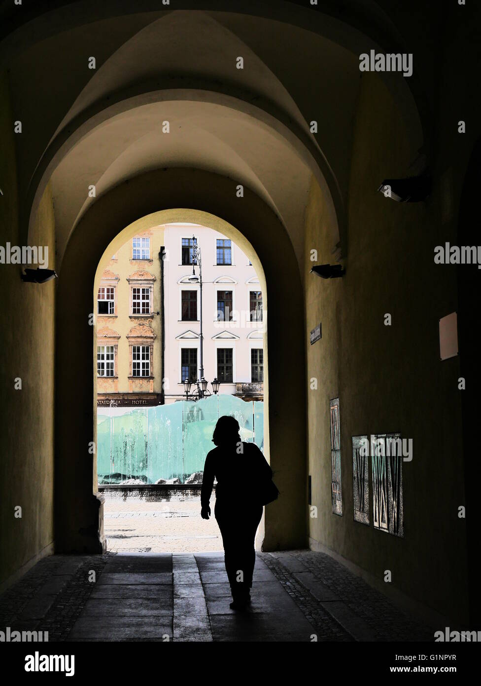 Person entering the city gates Stock Photo - Alamy