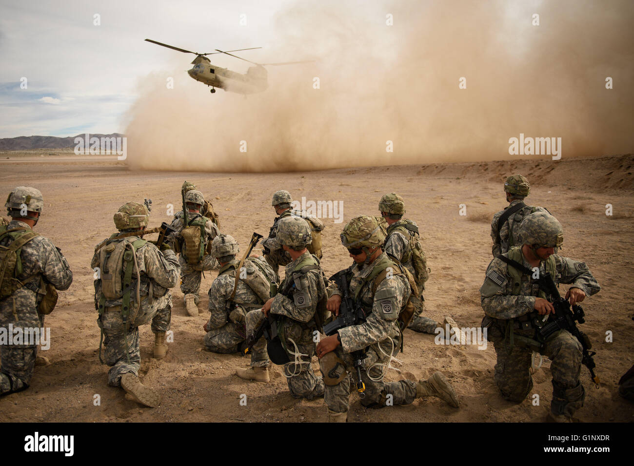 Fort Irwin, California, USA. 6th Aug, 2015. Dust kicks up from a ...
