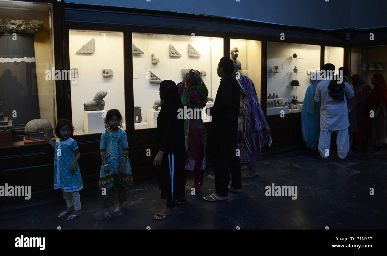 Pakistani visitors look different stuff of collection on display at the ...