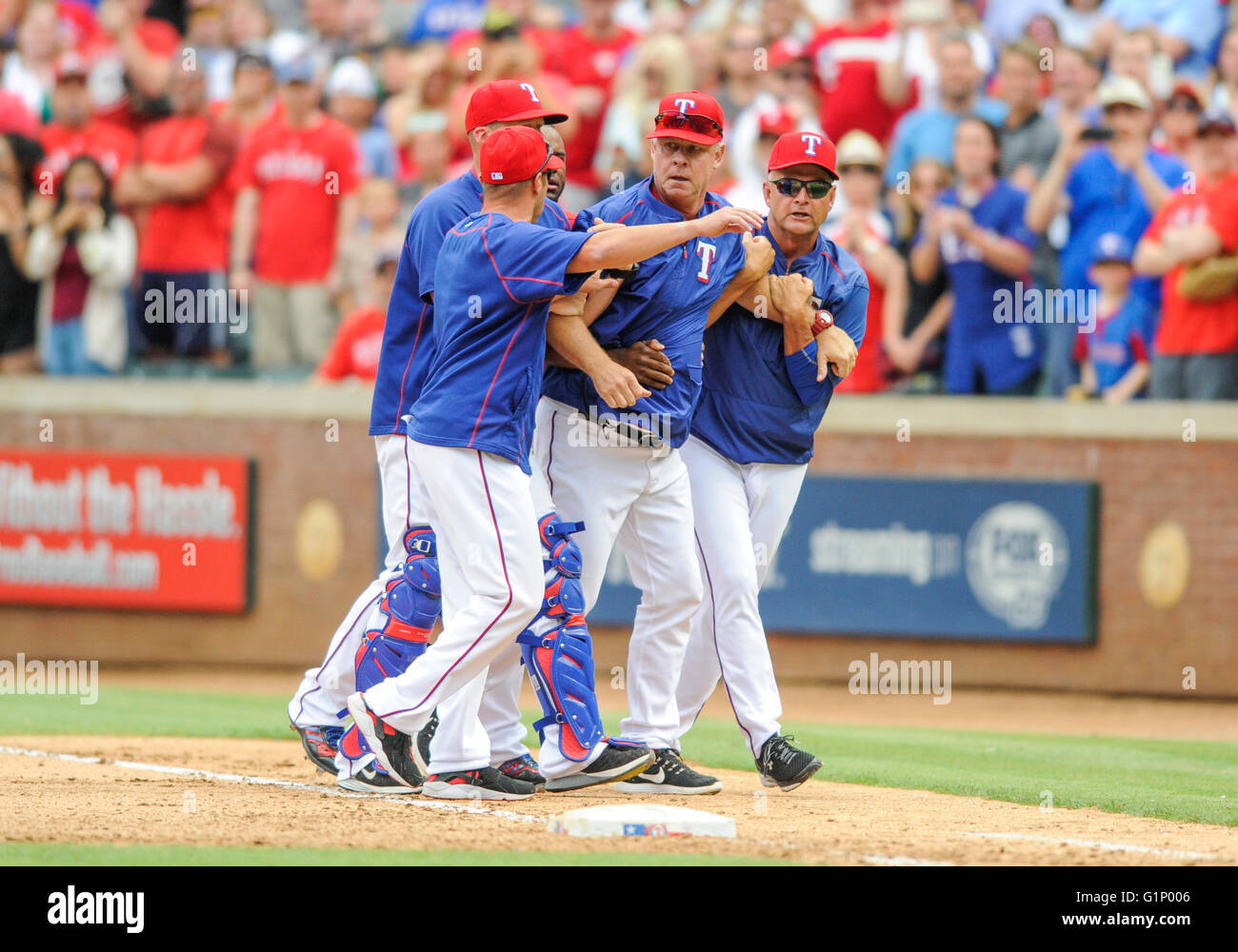 May 15, 2016: Texas Ranges bench coach Steve Buechele is pulled off the ...