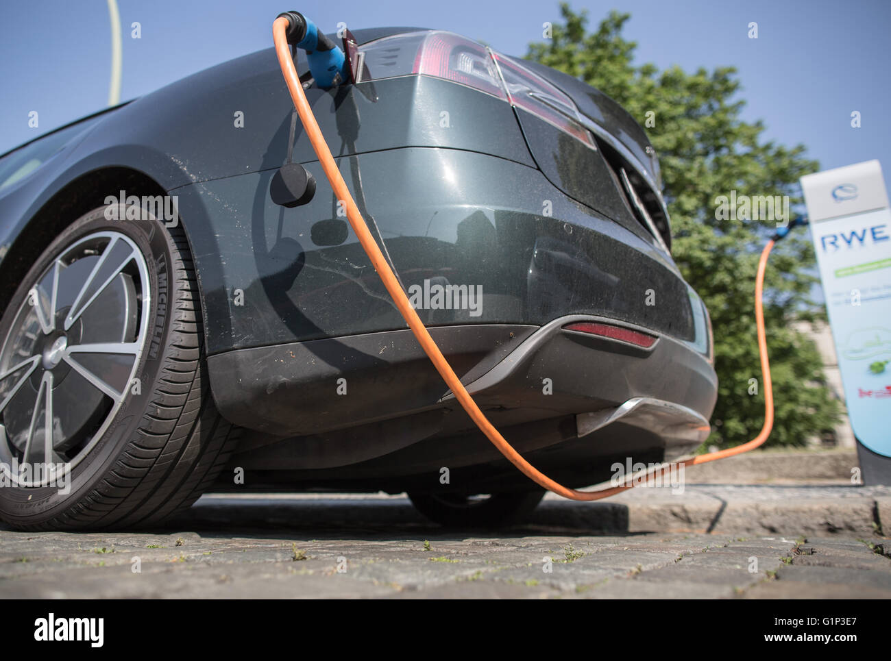 An E-car is being charged at a charging station in Berlin, Germany, 18 ...