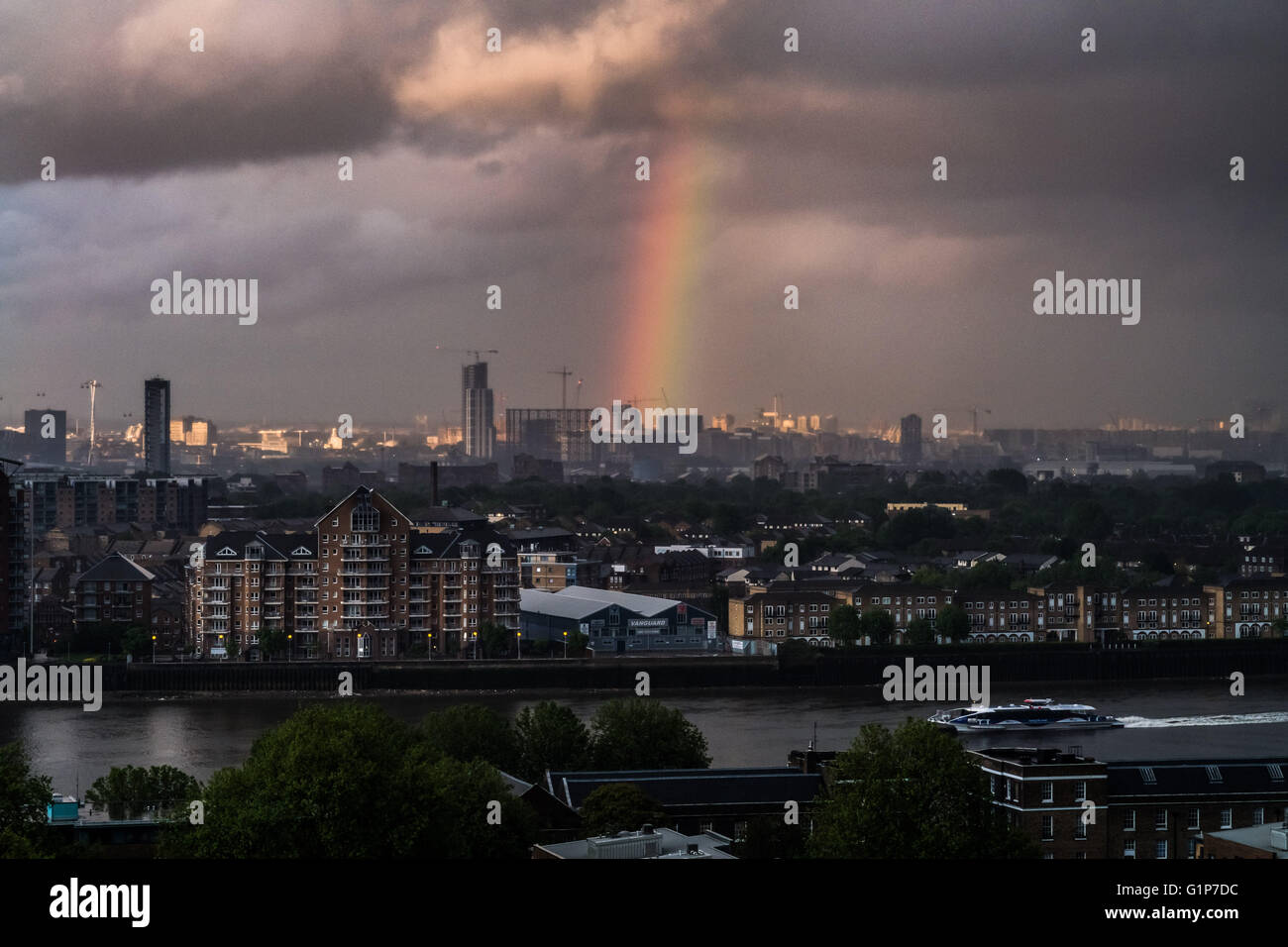 London, UK. 18th May, 2016. UK Weather: Colourful rainbow breaks during ...