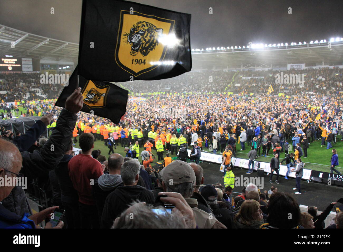 Hull City football fans celebrate on the pitch at the KCom Stadium on ...