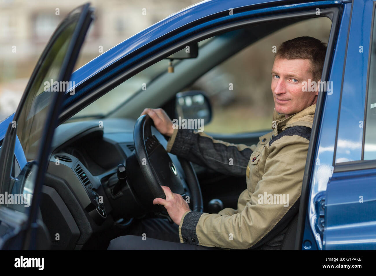 A young man in his car Stock Photo - Alamy