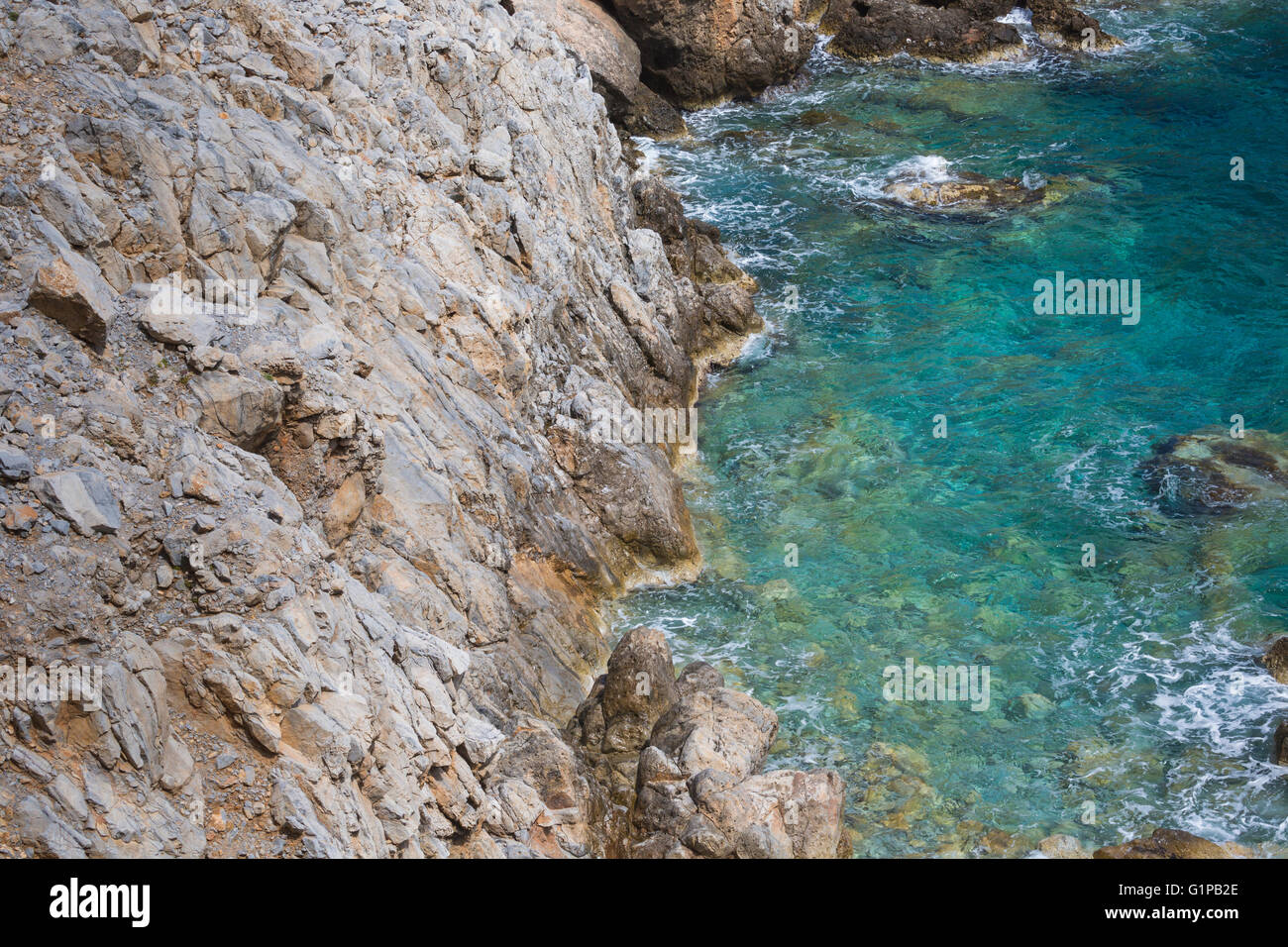 Beautiful Deep blue sea and rocks in Greece Stock Photo - Alamy