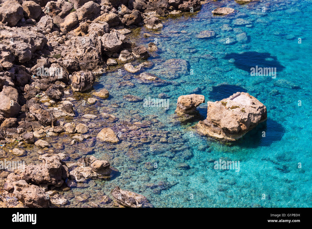 Beautiful Deep blue sea and rocks in Greece Stock Photo - Alamy