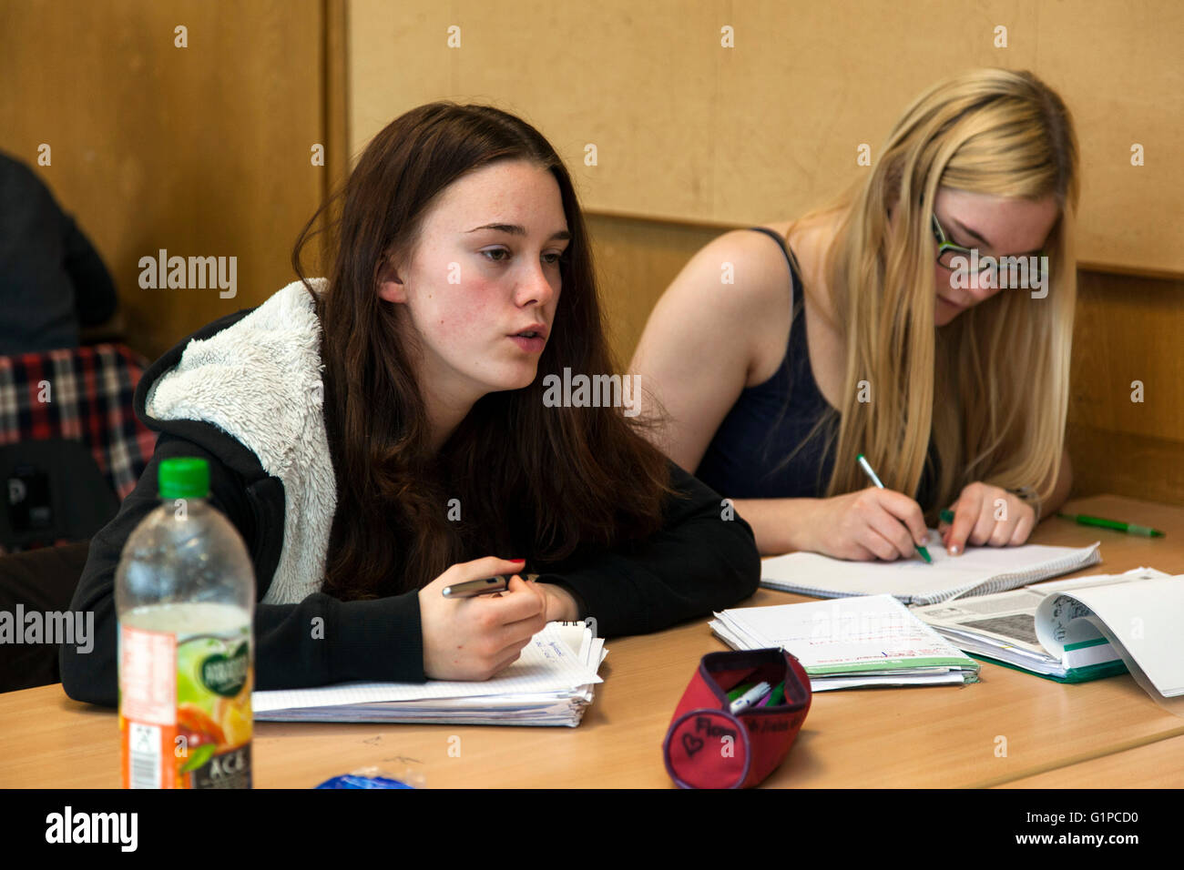 Students in the classroom during a writing task Stock Photo - Alamy