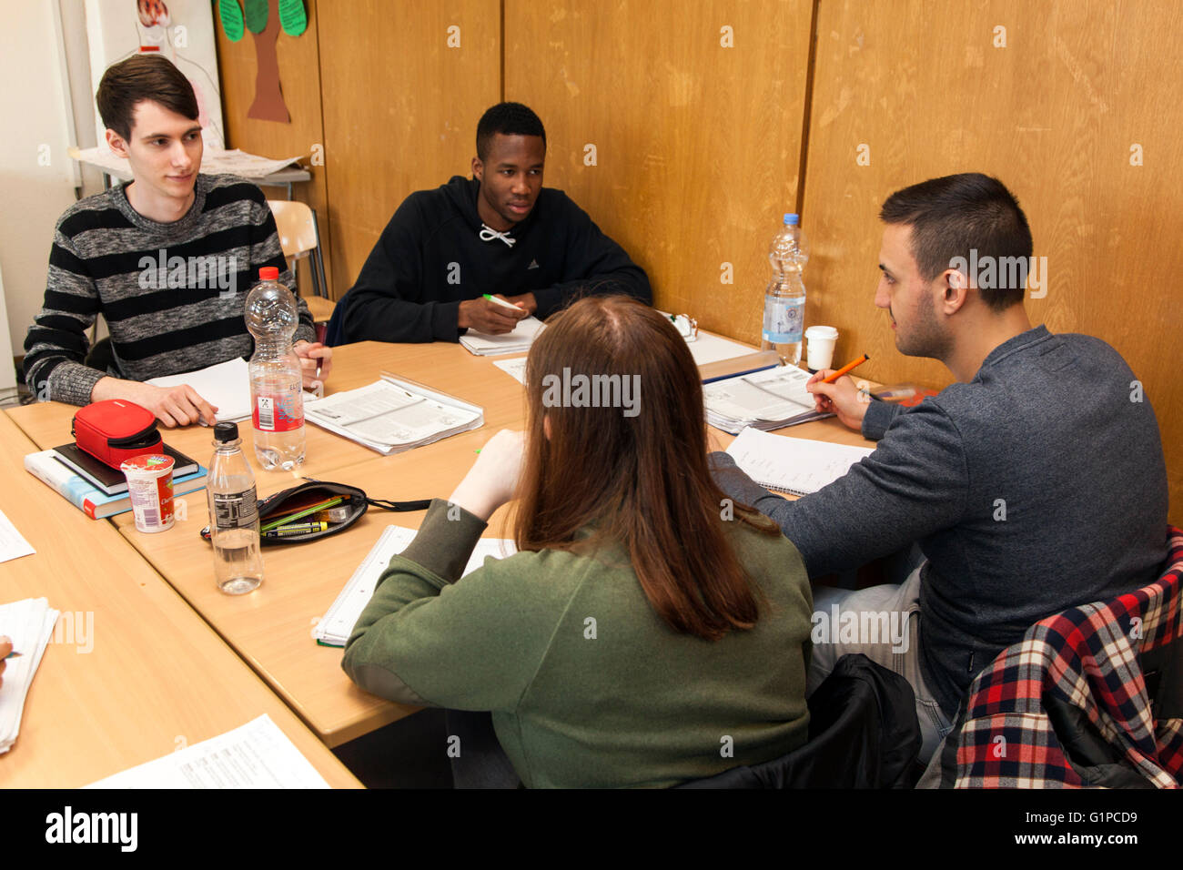 Students in the classroom during a writing task Stock Photo - Alamy