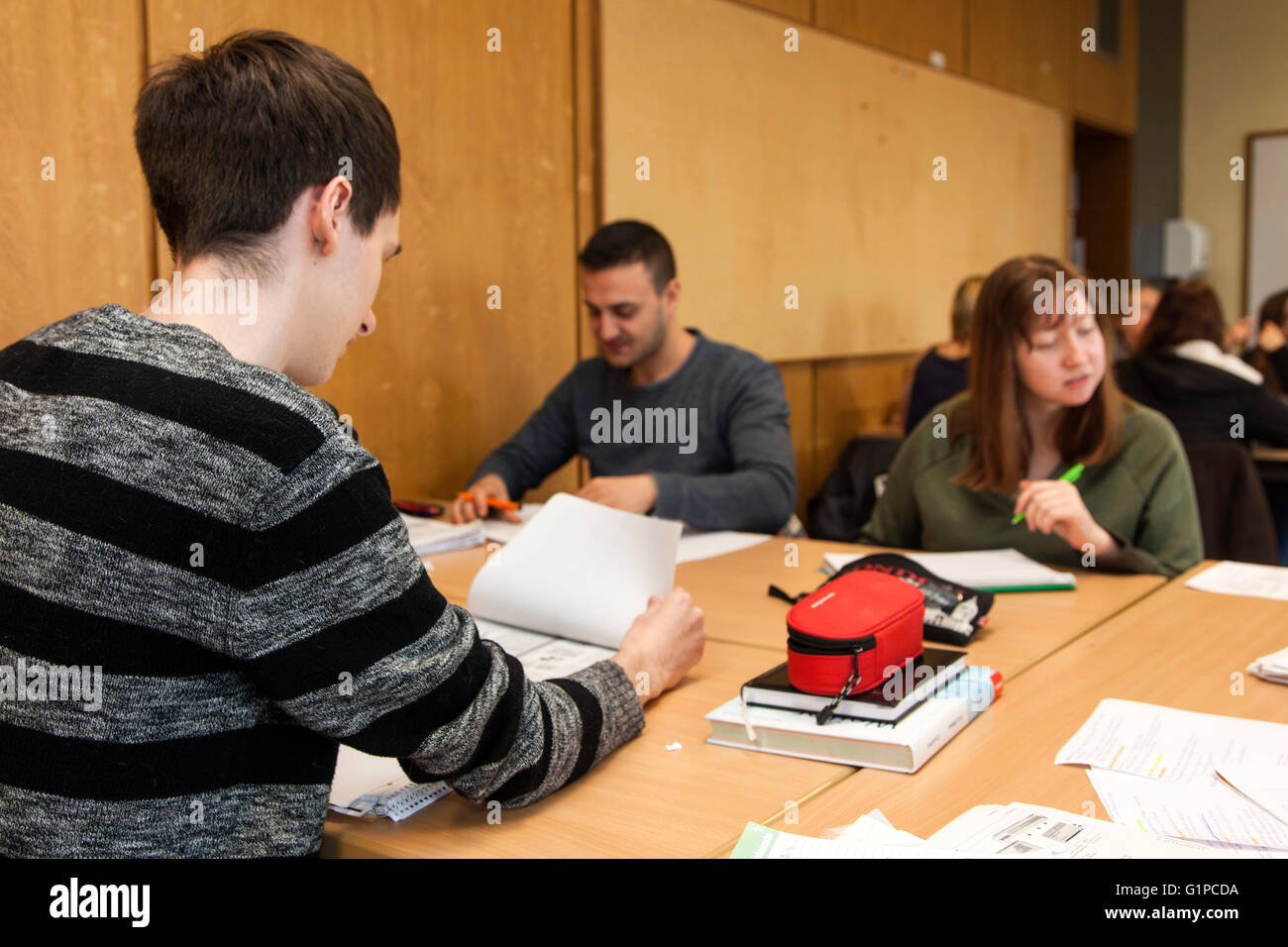 Students in the classroom during a writing task Stock Photo - Alamy