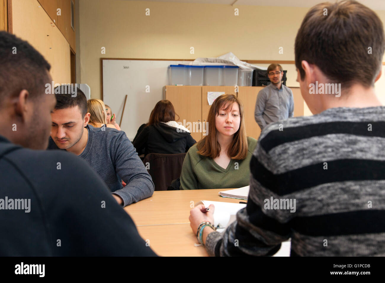 Students in the classroom during a writing task Stock Photo - Alamy