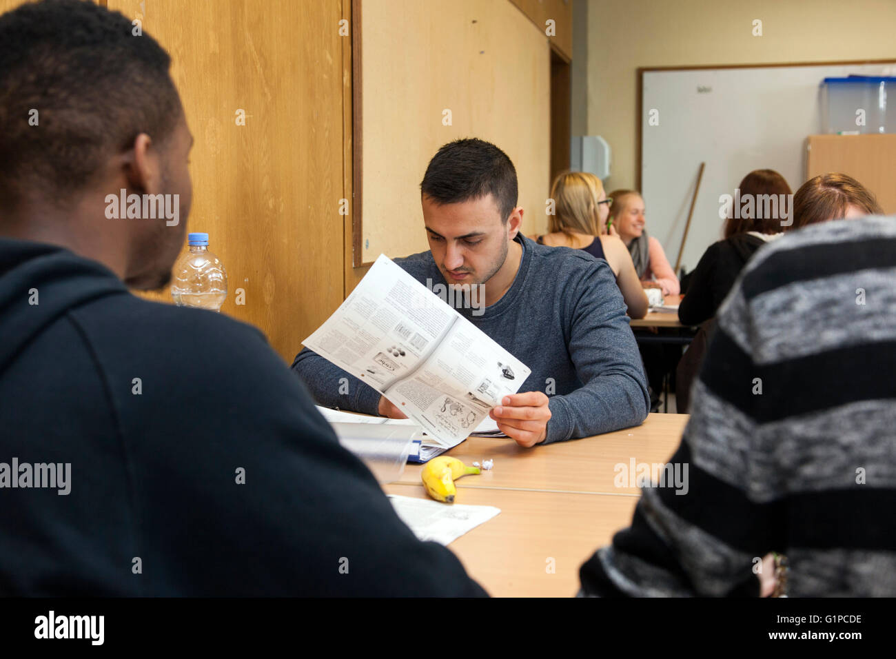 Students in the classroom during a writing task Stock Photo - Alamy