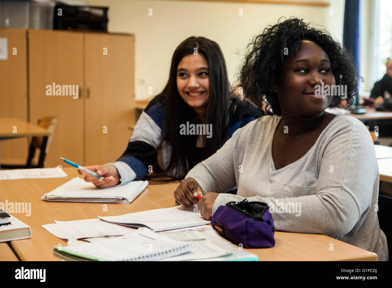 Students in the classroom during a writing task Stock Photo - Alamy