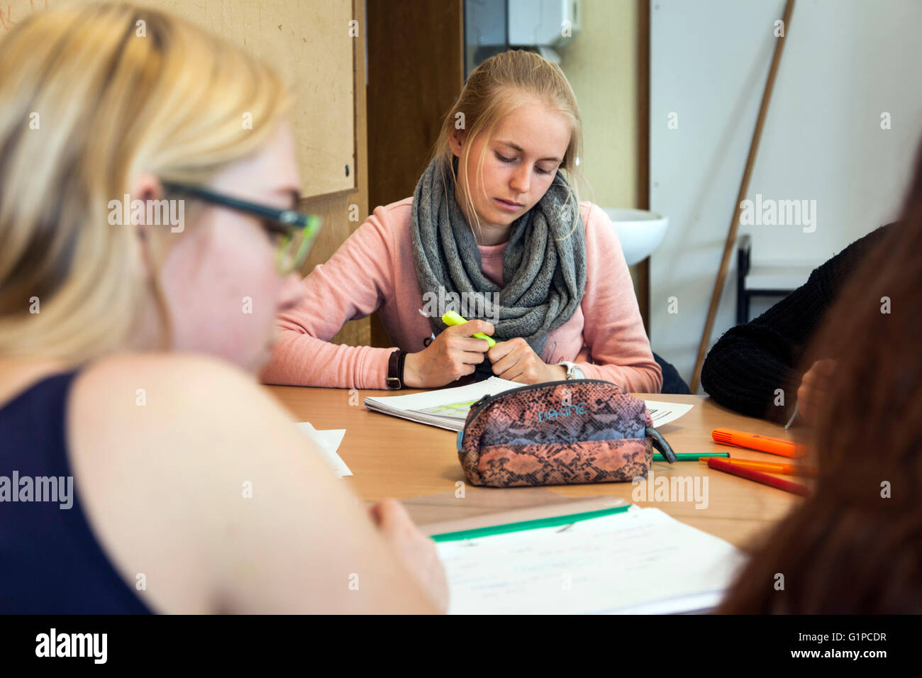 Students in the classroom during a writing task Stock Photo - Alamy
