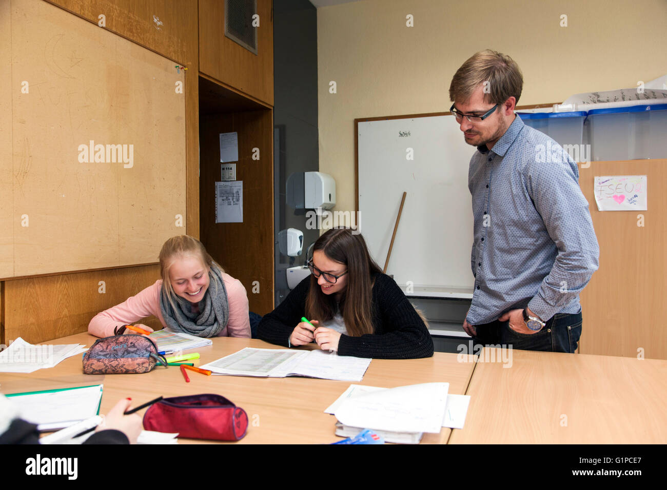 Students in the classroom during a writing task Stock Photo - Alamy