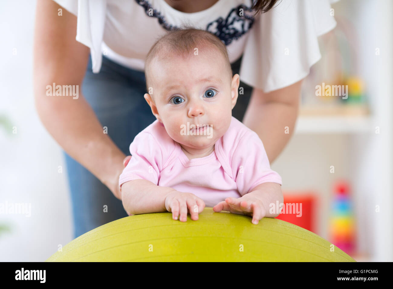 Playing baby on fit ball hi-res stock photography and images - Alamy