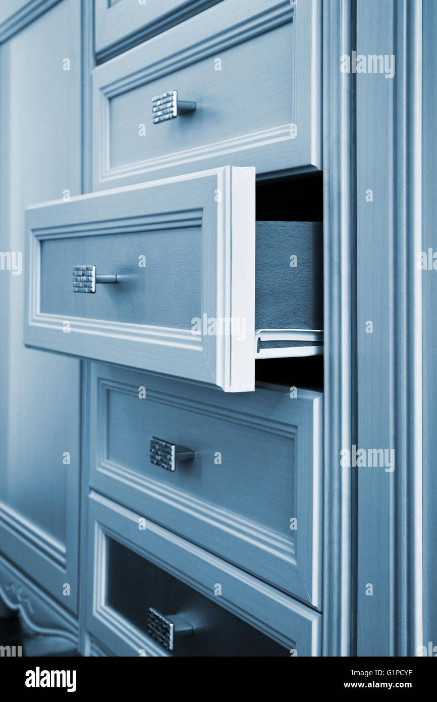 beautiful cabinet with drawers in a modern room Stock Photo - Alamy