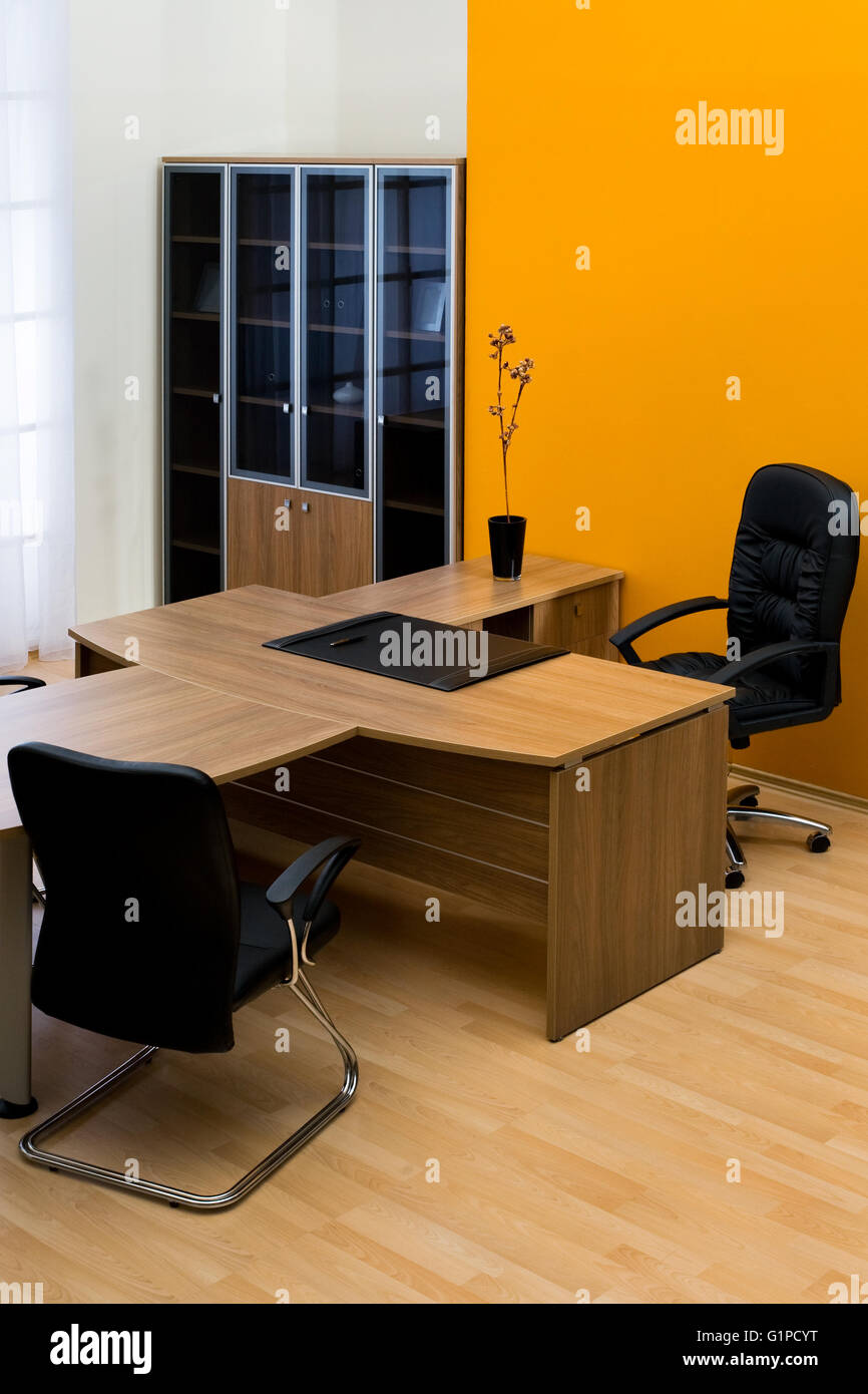 large wooden desk in a modern office Stock Photo - Alamy