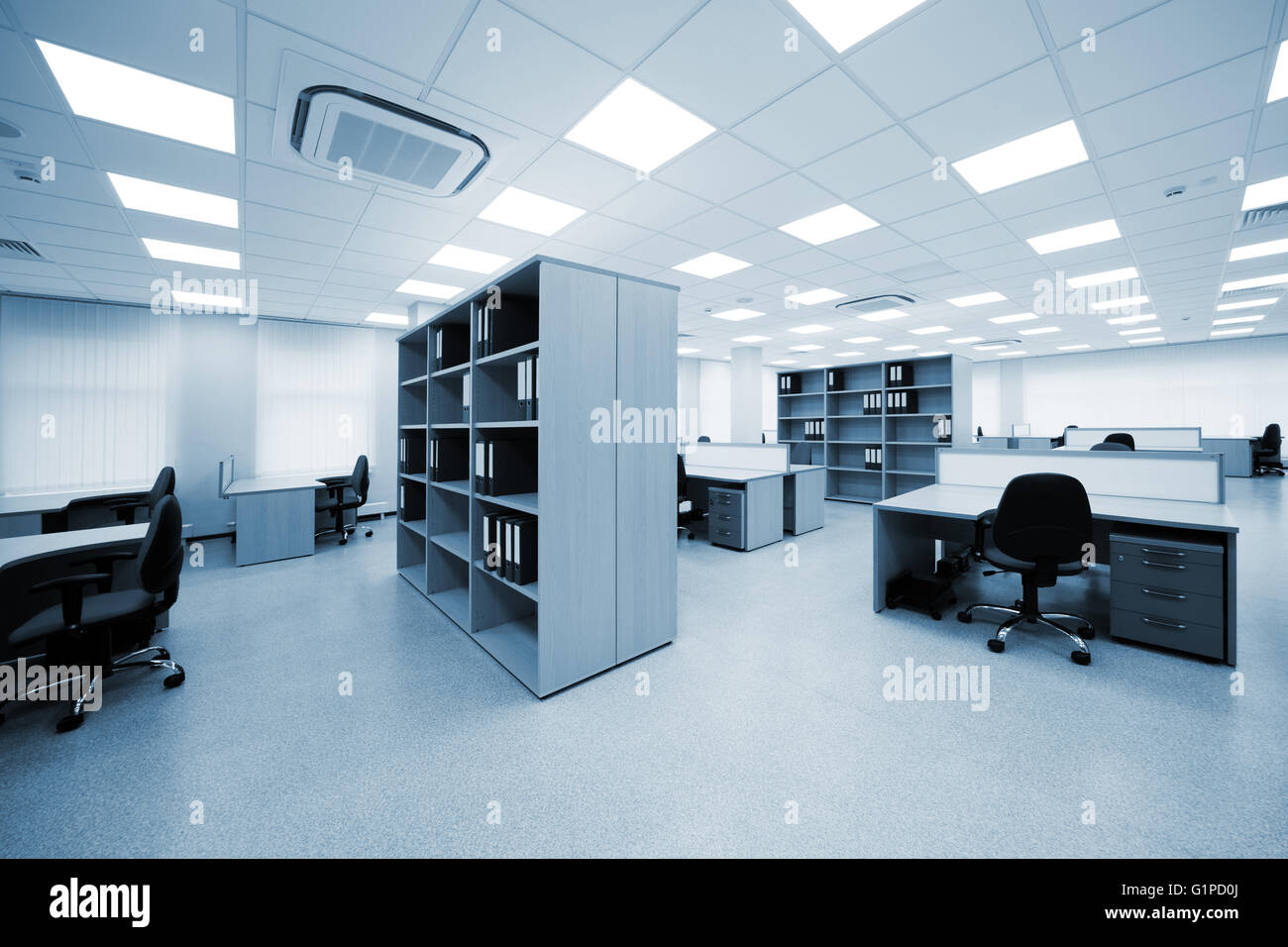desks and bookcases in the modern office Stock Photo - Alamy