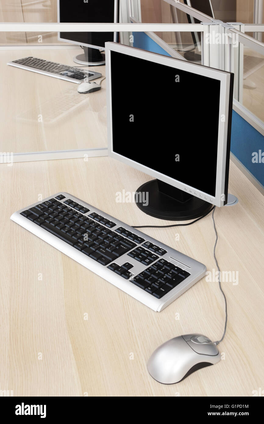 computers behind the glass in a modern office Stock Photo - Alamy